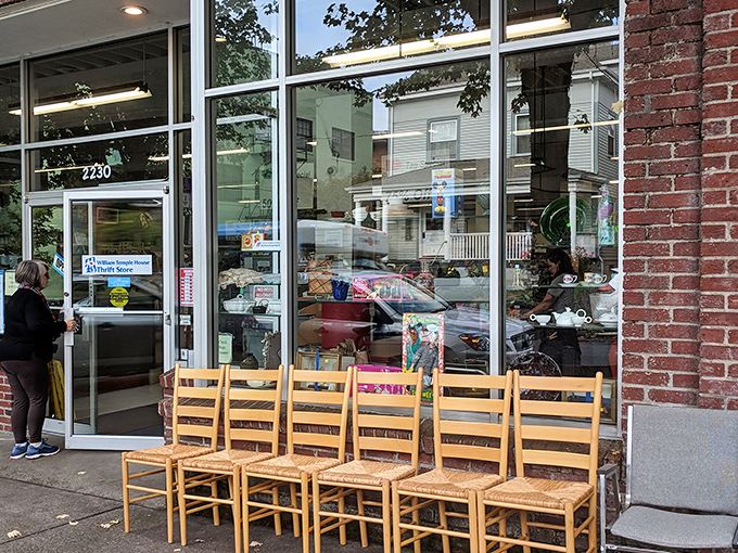 The treasure hunt begins! Those wooden chairs lined up outside are like sentinels guarding the gateway to thrift nirvana.