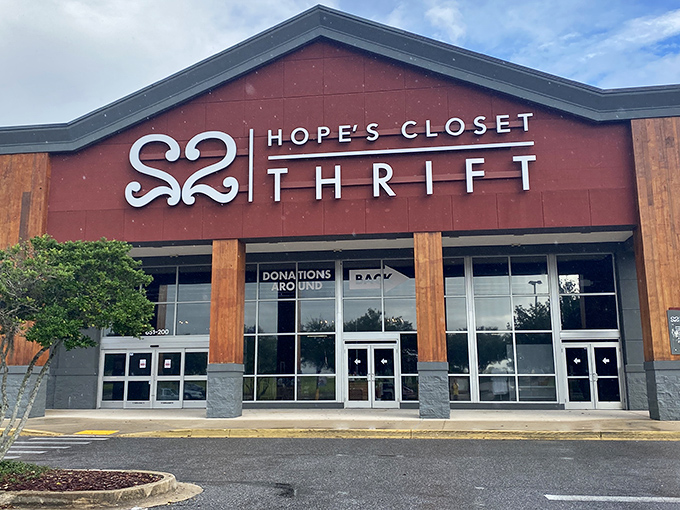 The striking red facade of Hope's Closet stands like a beacon for bargain hunters, promising treasures within those spacious walls.