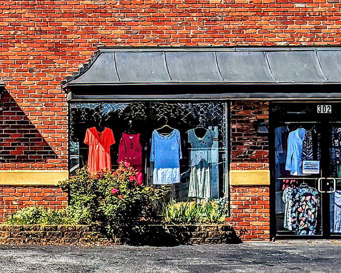 The unassuming brick exterior of 4 Paws Thrift Store, where colorful clothing displays hint at the treasure trove waiting inside. Like a thrifting tardis, it's bigger on the inside! 
