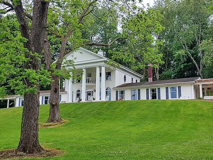 The grand white columns and sweeping lawn make this Georgian Manor look like it was plucked straight from a period drama. Mr. Darcy might appear at any moment.