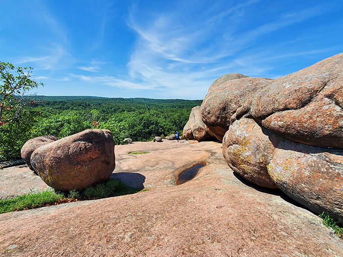 Nature's own sculpture garden where massive pink granite boulders stand sentinel over the Missouri landscape, inviting explorers of all ages to marvel at geological artistry.