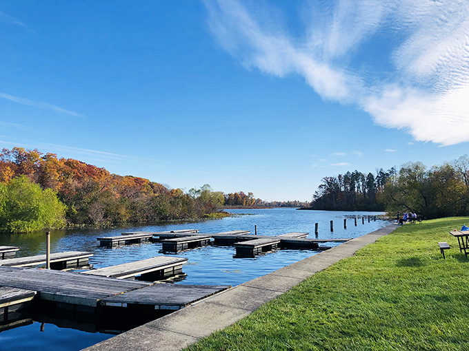 Nature's perfect mirror &ndash; Punderson Lake reflects autumn's fiery palette while boat docks patiently wait for the next adventure seeker.