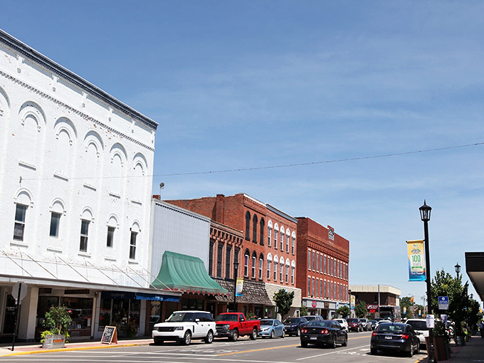 Historic charm meets small-town bustle on Fremont's Front Street, where red brick buildings stand as silent witnesses to generations of Ohio stories.