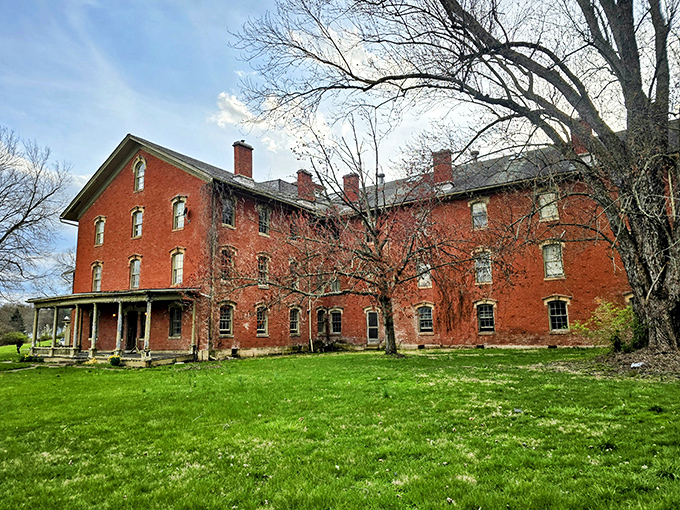 The imposing red brick facade stands like a Victorian novel come to life, its windows watching over Lancaster with century-old stories to tell.