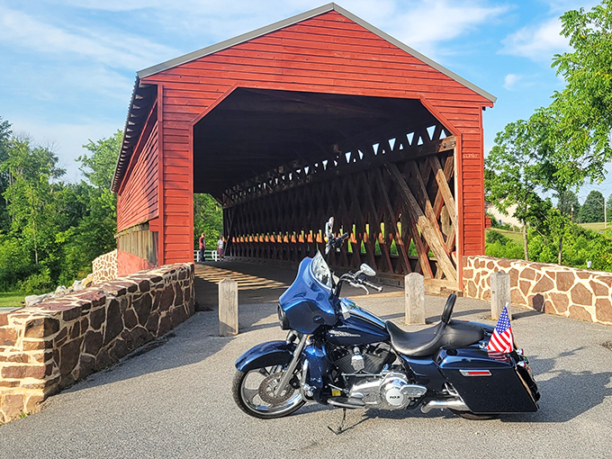 The crimson hue of Sachs Covered Bridge against Pennsylvania's greenery creates a postcard-perfect scene that no Instagram filter could improve upon.
