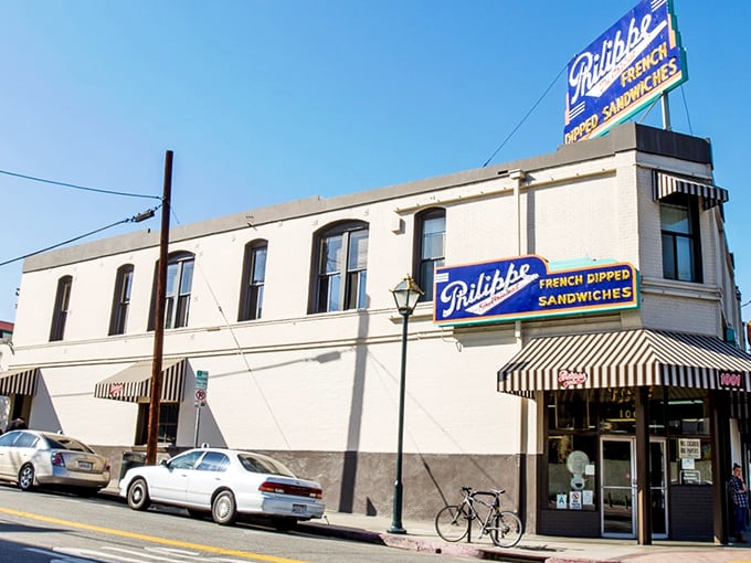 The iconic blue and yellow signage of Philippe's stands as a beacon for sandwich lovers, a landmark that's been drawing Angelenos for generations.