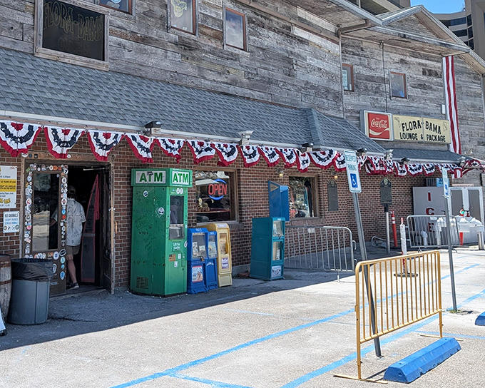 The weathered wooden exterior of Flora-Bama tells stories that no Instagram filter could ever capture. State-line straddling never looked so inviting!