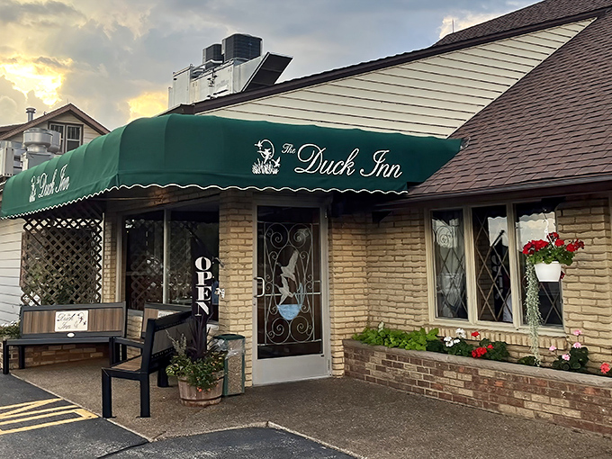 The iconic green awning beckons like an old friend, promising comfort and indulgence just beyond those doors. Wisconsin supper club perfection awaits.