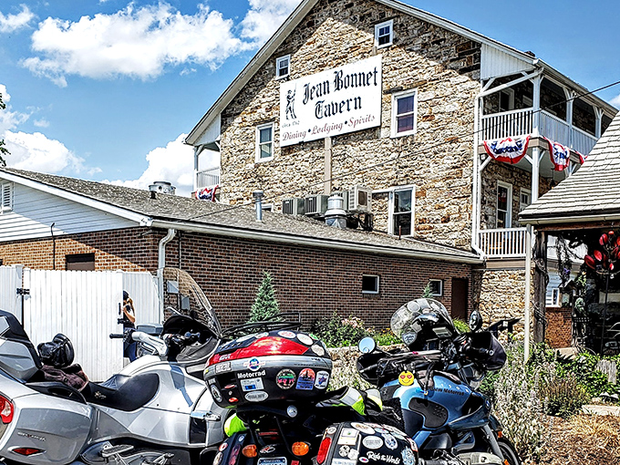 Stone walls that have witnessed centuries of American history stand proudly under Pennsylvania skies, adorned with patriotic bunting that seems to whisper, "George Washington slept here."