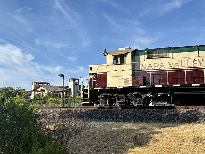 The iconic burgundy and cream locomotive stands ready for adventure, a gleaming time machine that transports passengers through California's most delicious landscape.