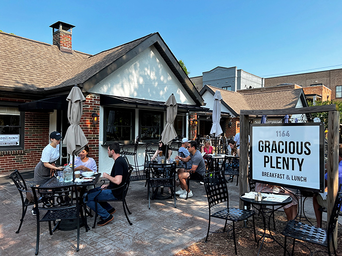 The charming brick exterior of Gracious Plenty beckons with its inviting patio&mdash;proof that breakfast paradise often comes in unassuming packages.