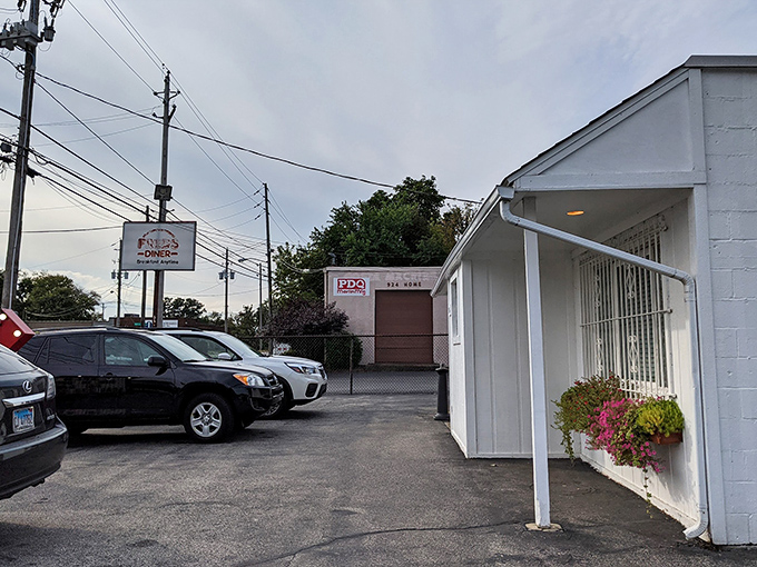 The unassuming exterior of Fred's Diner proves once again that culinary treasures often hide in plain sight. This white-painted Akron institution promises zero pretension and maximum flavor. 
