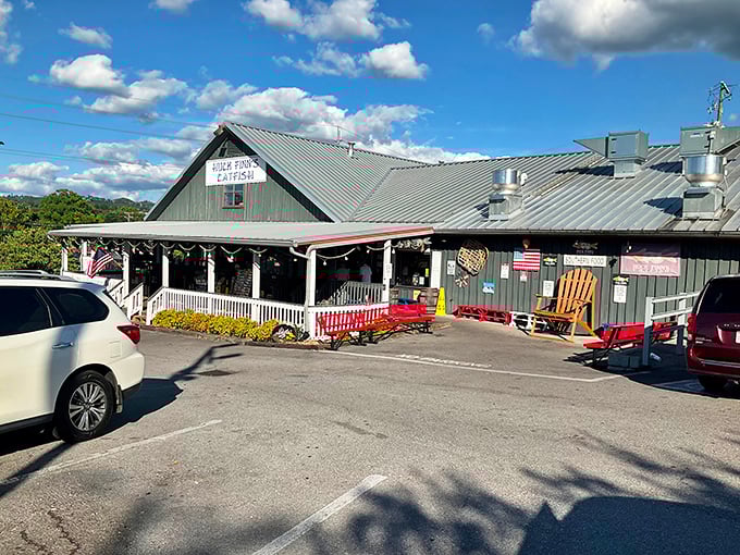 The unassuming green-roofed exterior of Huck Finn's Catfish stands as a beacon of Southern comfort amid Pigeon Forge's flashier attractions. Sometimes the best treasures don't need neon signs.