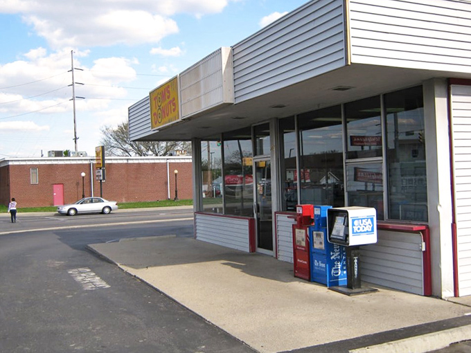 The unassuming exterior of Tom's Donuts stands like a beacon of sweetness in Fort Wayne, promising simple pleasures without the fancy frills.