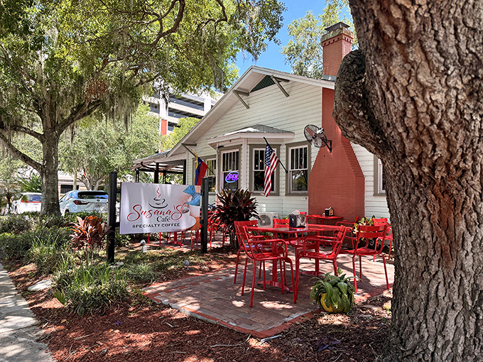 A charming white cottage with vibrant red outdoor seating, Susana's Cafe looks like it was plucked from a storybook and dropped under Florida's magnificent oak trees.