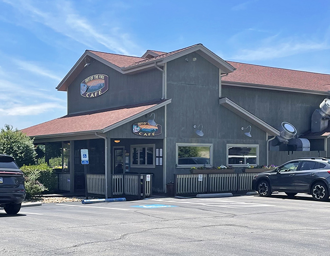 The unassuming exterior of Out of the Fire Cafe hides culinary treasures within, like finding a Michelin-worthy meal in a cozy mountain cabin.