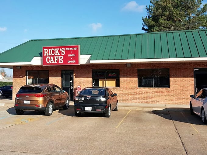 The unassuming brick exterior with its distinctive green roof and bold red sign promises what every great local spot should: no pretense, just honest-to-goodness deliciousness waiting inside.