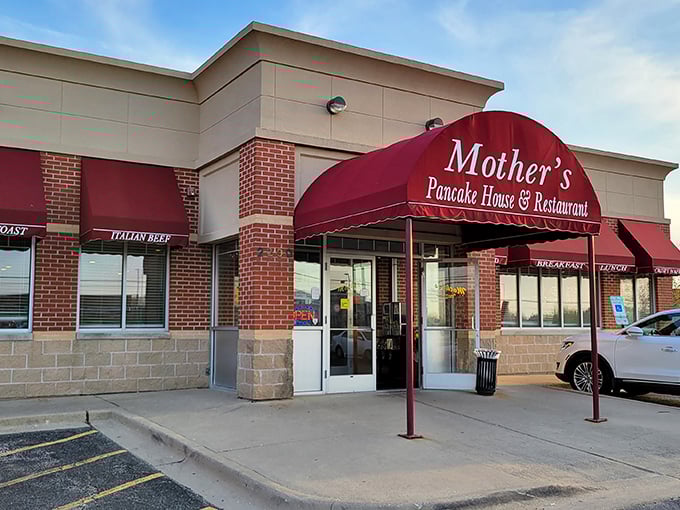 The iconic red awning of Mother's Pancake House beckons hungry diners like a breakfast lighthouse guiding ships to shore.
