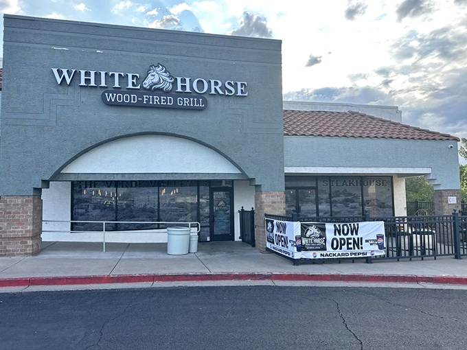 The unassuming exterior of White Horse Wood-Fired Grill proves the old adage: never judge a burger joint by its stucco facade.