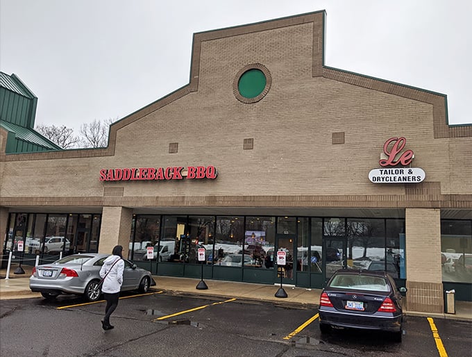 The bright red letters against beige brick promise smoky delights within. Like a barbecue beacon calling to hungry souls across Okemos.