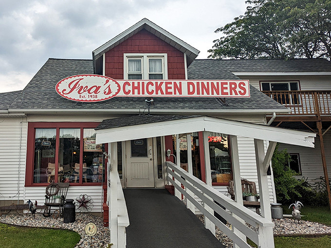 The iconic red-roofed Iva's Chicken Dinners stands like a beacon of comfort food, promising culinary salvation to hungry travelers since 1938.