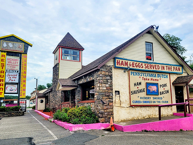 The stone-and-wood exterior of Hickory Valley Farm Restaurant stands like a rustic time capsule in Swiftwater, complete with that charming tower that practically winks at you.