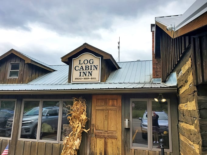 The Log Cabin Inn's weathered wooden exterior isn't just rustic charm&mdash;it's a promise of culinary treasures hiding behind that unassuming frontier facade.