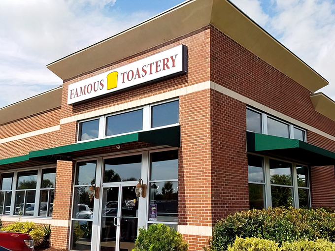 The cheerful yellow toast icon on Famous Toastery's sign is like a beacon for breakfast enthusiasts&mdash;promising morning salvation in brick-and-mortar form.
