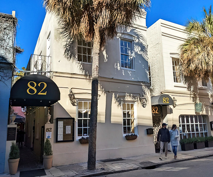 The unassuming cream exterior with its elegant black awning feels like stumbling upon a secret Charleston treasure. History whispers from every corner. 