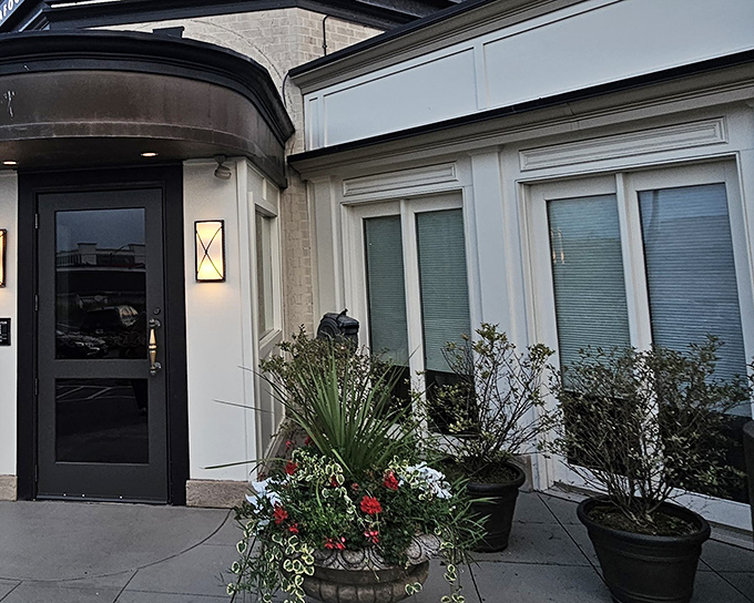 The unassuming exterior of Delmonico's belies the culinary magic happening inside, like finding a treasure chest disguised as a mailbox.