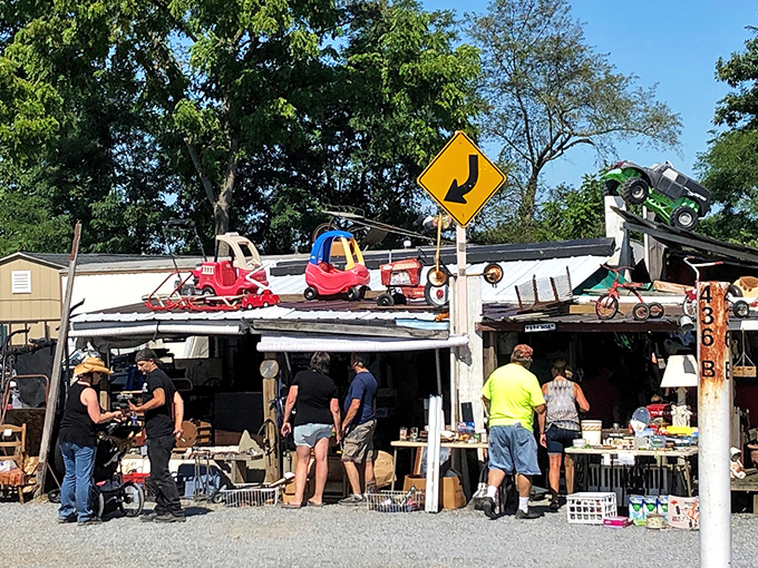 Where one person's "junk" becomes another's treasure! This vendor's creative display showcases childhood toys perched atop the roof, beckoning nostalgic collectors.