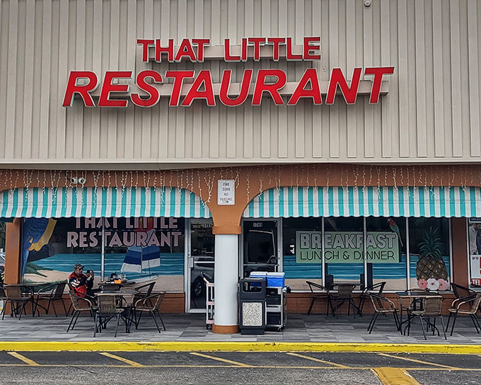 The turquoise-striped awning and tropical mural say "Florida" louder than a sunburned tourist asking for directions to the beach.