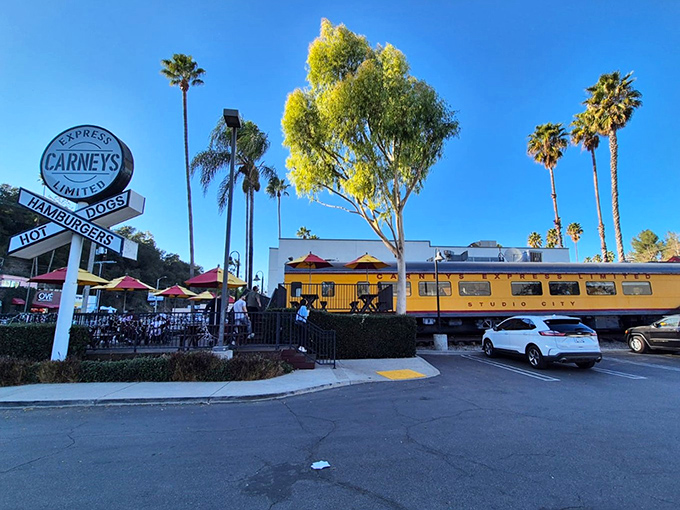 The bright yellow train car of Carney's stands out against the California sky like a beacon of burger hope on Ventura Boulevard.