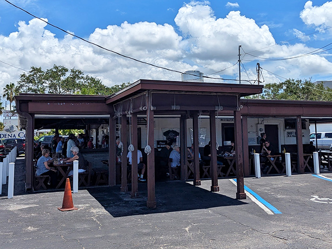 No architectural awards here, just decades of smoke-infused magic. This unassuming brown structure houses Florida seafood dreams that fancy restaurants can only imitate.
