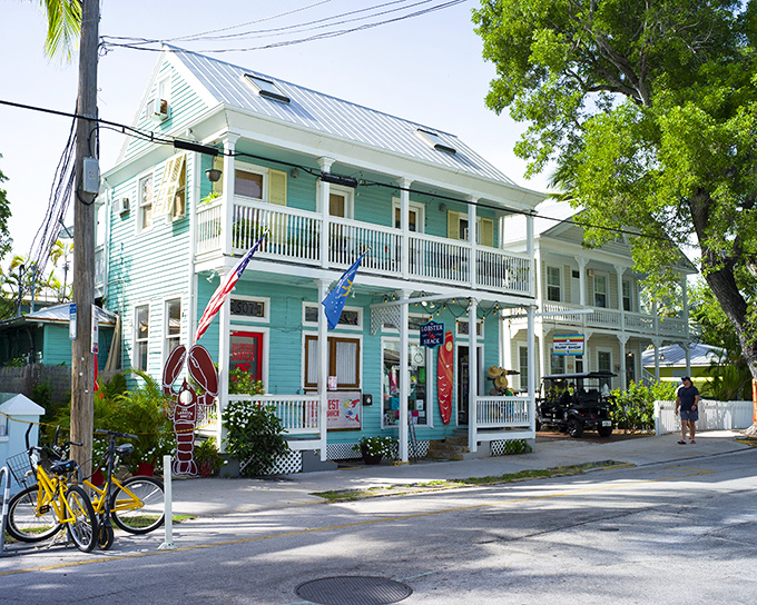 The turquoise beacon of seafood salvation stands proudly on Key West's sun-drenched streets, promising lobster treasures within its classic island architecture.