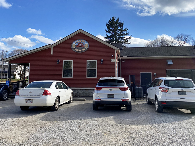 The bright red exterior of Lager Heads stands like a beacon for barbecue pilgrims, promising smoky treasures within those humble walls.