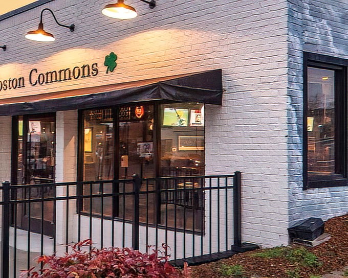 Boston Commons welcomes you with its charming white brick façade, shamrock accents, and inviting bench—the perfect prelude to the British-Irish culinary adventure waiting inside.