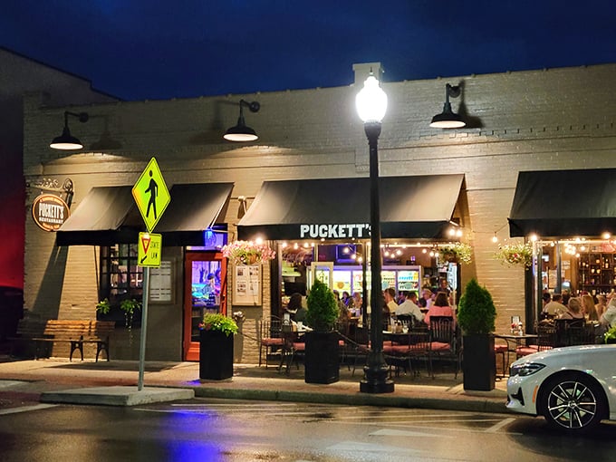 Puckett's storefront glows with Southern hospitality after dark, beckoning hungry travelers like a lighthouse for comfort food enthusiasts.