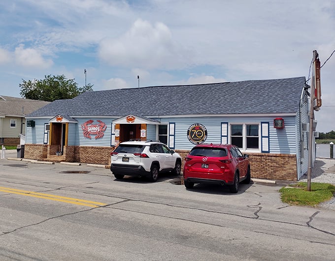 The iconic blue exterior with that rusty crab sign practically screams "seafood sanctuary." No fancy architects needed when you've got decades of delicious reputation.