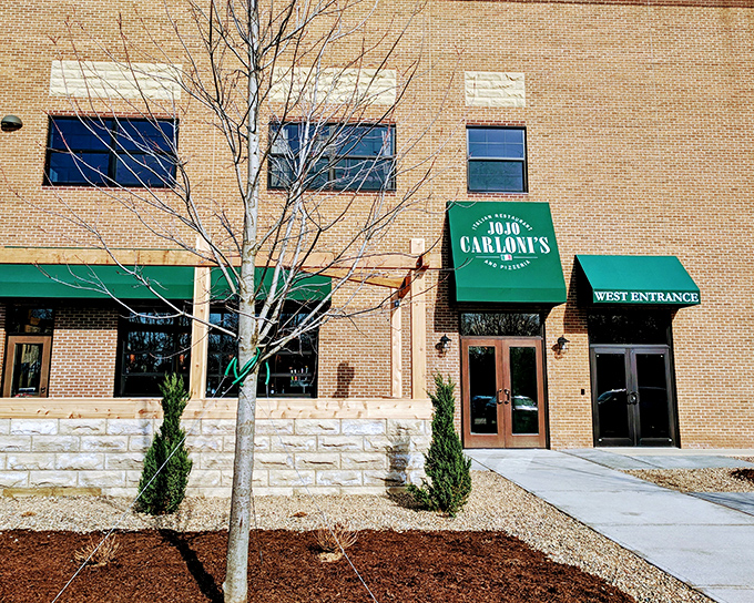 JoJo Carloni's welcoming brick exterior with signature green awnings stands like a beacon of Italian promise in Berea. The West Entrance beckons hungry travelers inside.