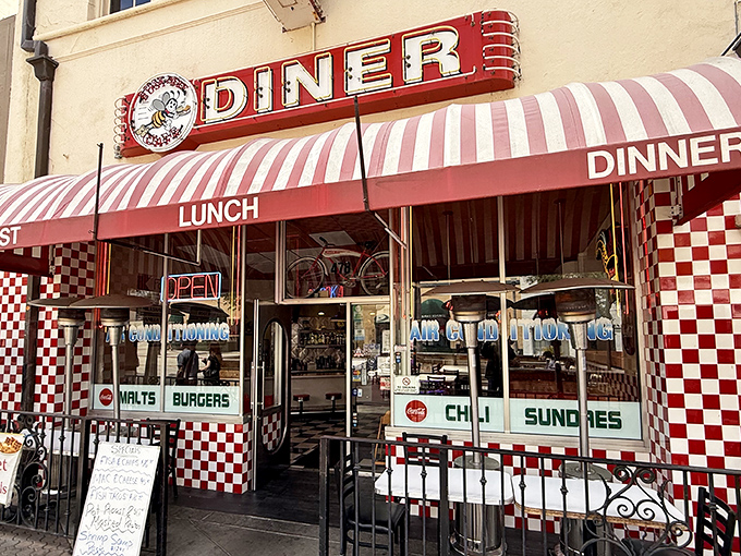 The red and white checkered facade isn't just inviting&mdash;it's practically shouting "Get in here and eat something wonderful!" Classic Americana at its finest.