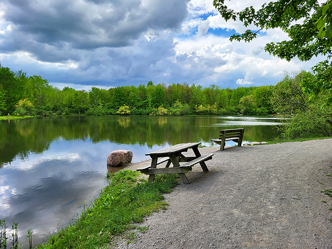 Nature's perfect mirror act! Fall foliage creates a double feature of color on Hidden Lake's glassy surface, with a picnic table perfectly positioned for front-row seats.