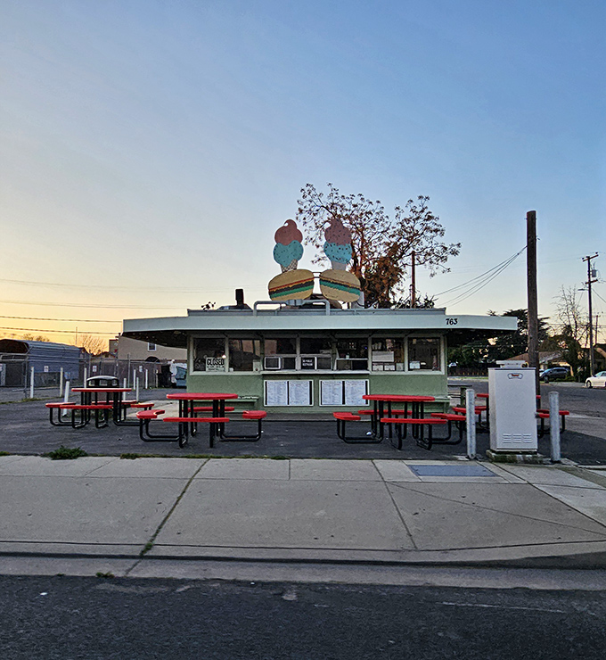 That mint-green time capsule with the burger-and-ice-cream crown isn't trying to be retro—it just never stopped being itself. Pure California roadside magic.