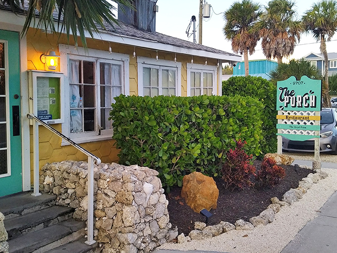 The little yellow cottage with the turquoise door isn't trying to impress anyone—until you taste what's cooking inside. Florida charm personified.