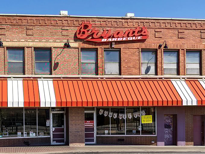 That iconic red script against brick isn't just a sign&mdash;it's a beacon calling barbecue pilgrims to one of Kansas City's most hallowed smoke temples. 