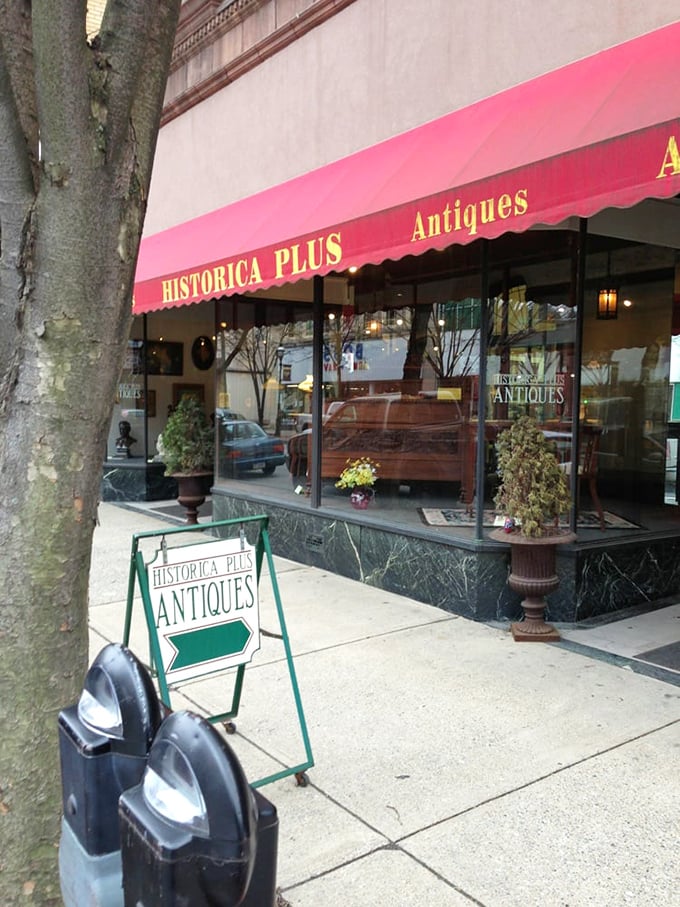 That cheerful red awning beckons like a beacon for treasure hunters seeking Pennsylvania's finest antique discoveries.