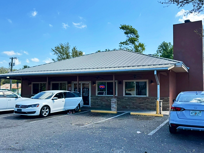 The unassuming exterior hides barbecue greatness like a superhero's secret identity. This modest building houses smoky treasures worth crossing county lines for. 