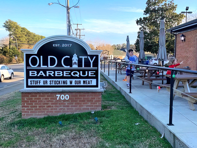 The sign says it all: "STUFF UR STOCKING W OUR MEAT." In Williamsburg, Old City Barbeque doesn't just serve food—it serves personality with a side of humor.