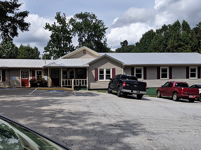 The unassuming entrance to Bar-H Barbecue proves once again that in the South, the most modest porches often hide the most magnificent flavors.