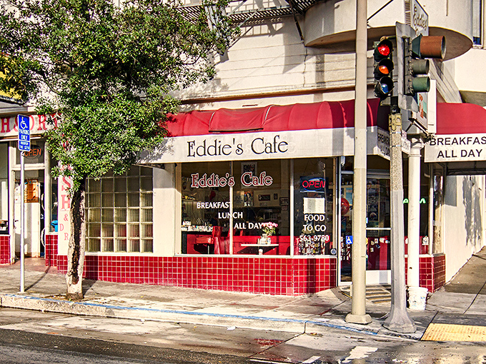 The iconic red-cushioned exterior of Eddie's Caf&eacute; promises breakfast salvation, standing like a beacon for hungry San Franciscans on Divisadero Street.